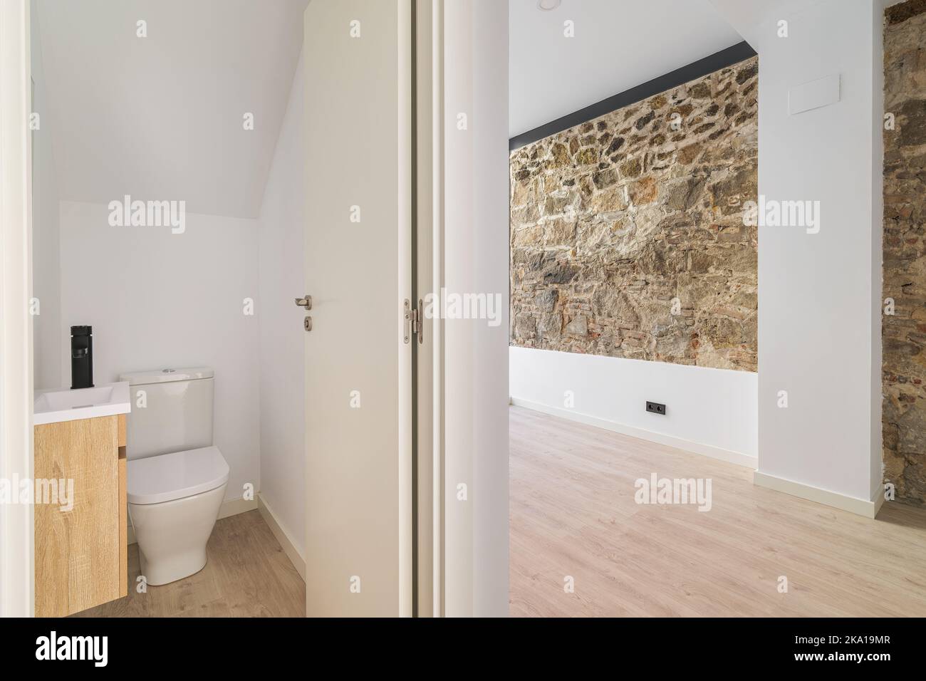 Refurbished apartment with restored ancient wall left from old city ...