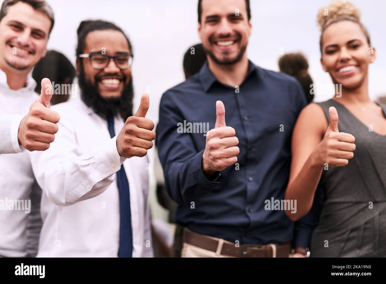 Success can be yours too. Portrait of a group of businesspeople showing ...