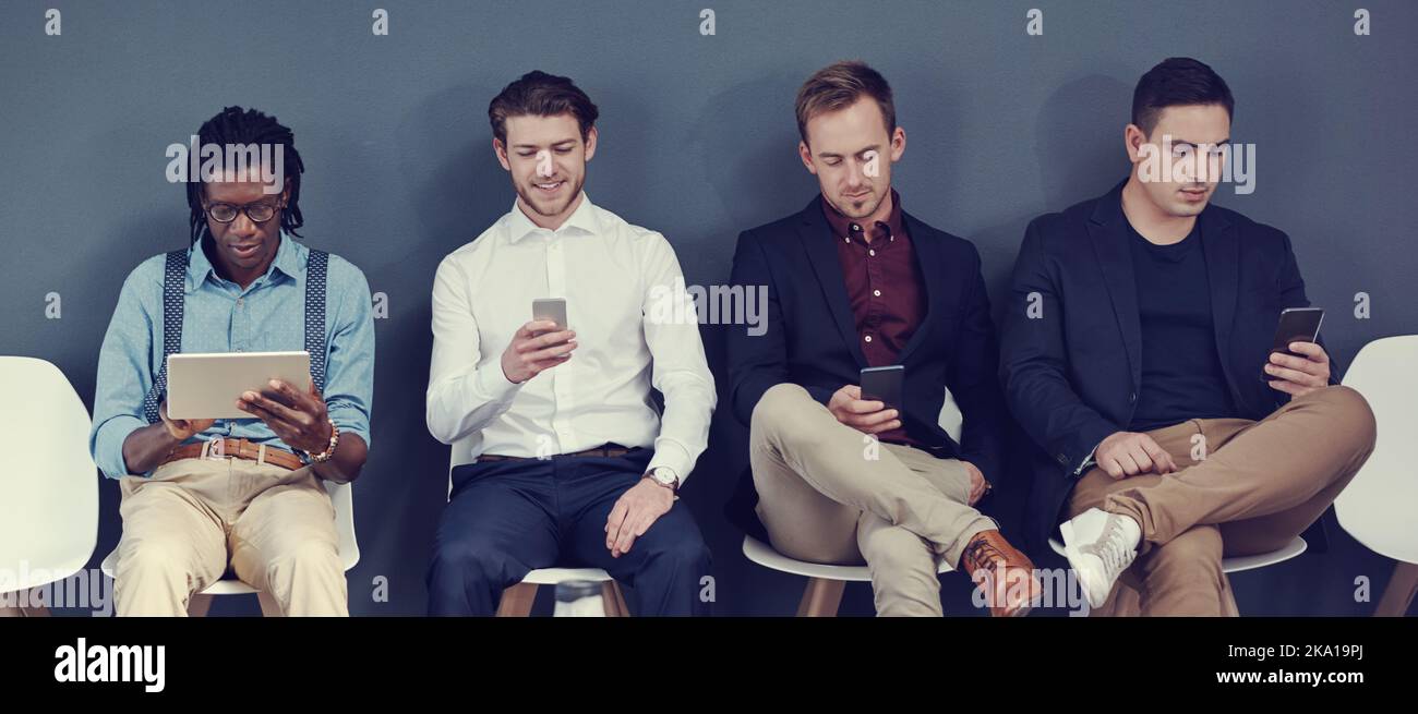 This could be potential colleagues. a group of businessmen using ...
