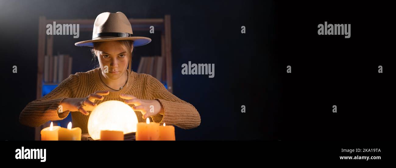 Soothsayer Using Crystal Ball To Predict Future At Table In Darkness