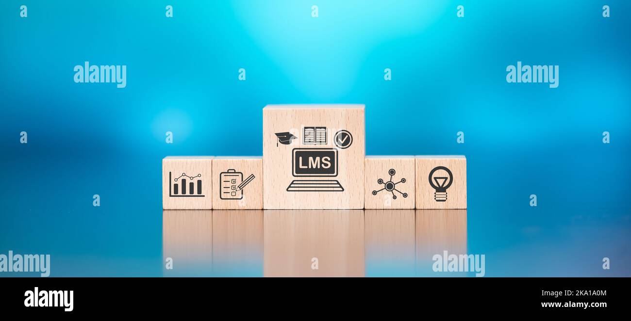 Wooden blocks with symbol of lms concept on blue background Stock Photo ...