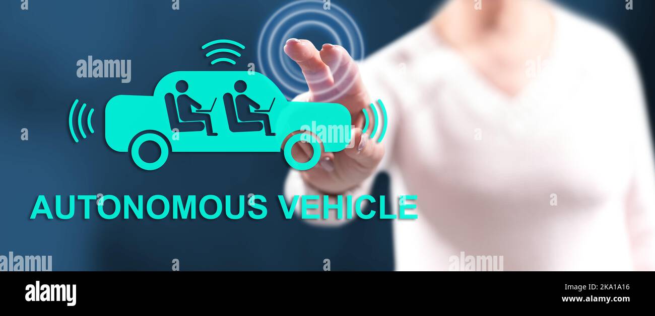 Woman touching an autonomous vehicle concept on a touch screen with her ...