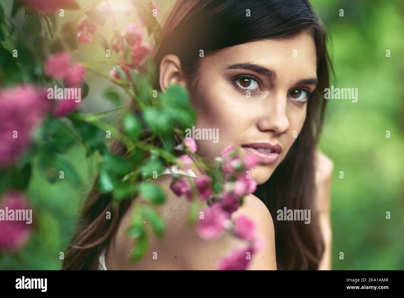 There is magic in her eyes. a beautiful young woman posing in nature ...