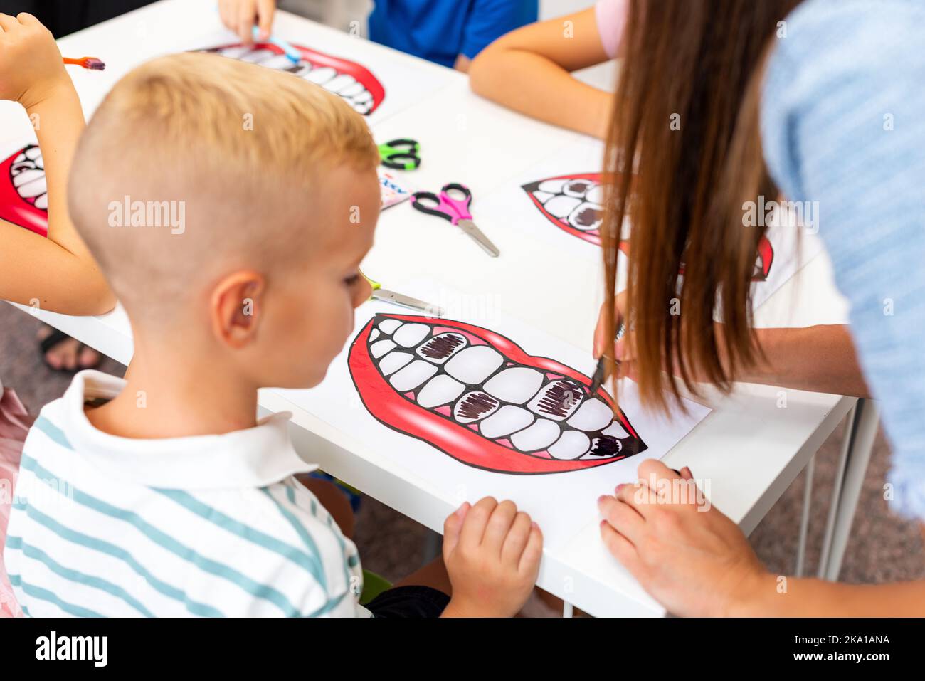 Child occupational therapy session. Group of children doing playful ...