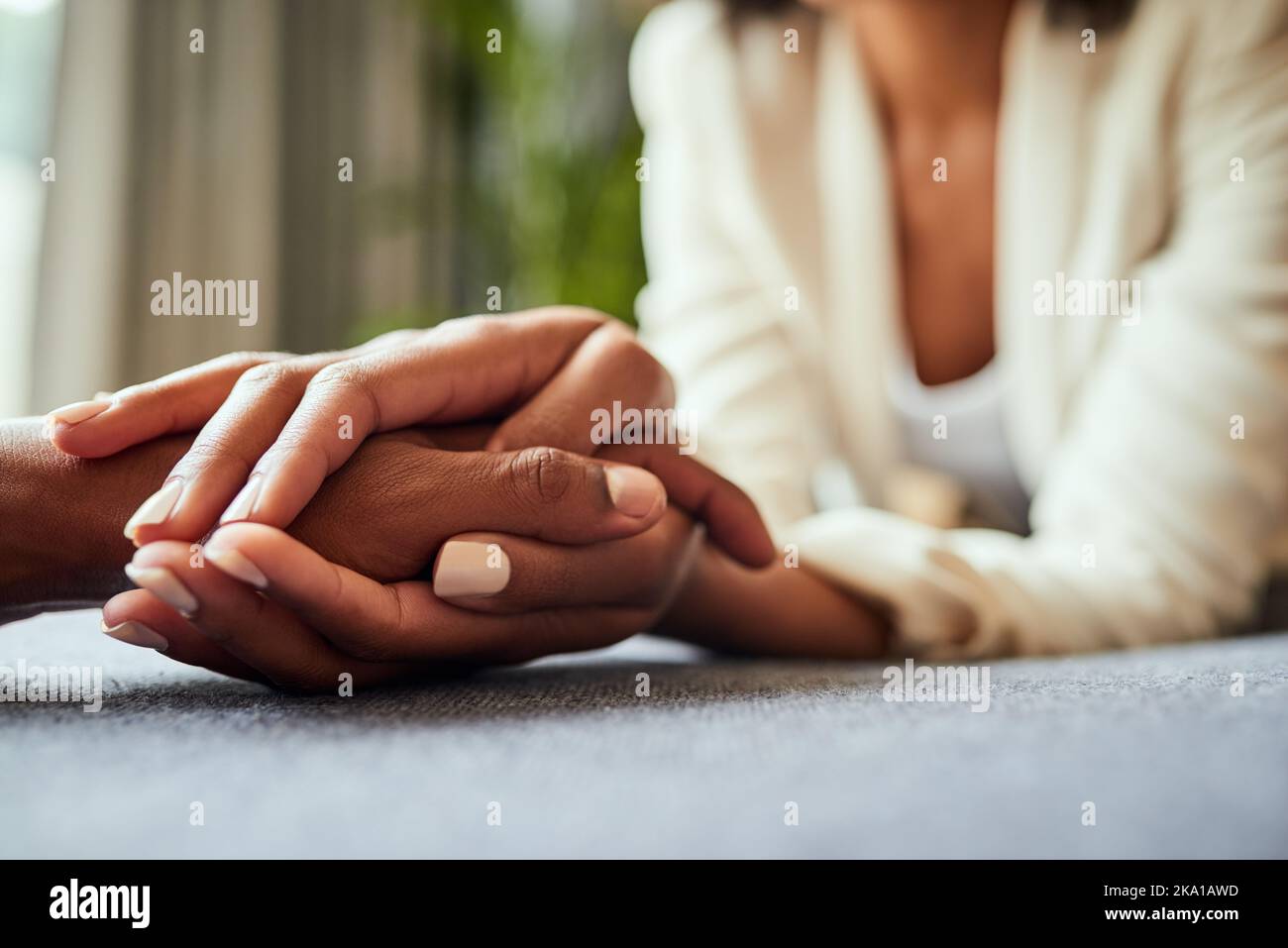An helping hand goes a long way. Closeup of two unrecognizable peoples ...