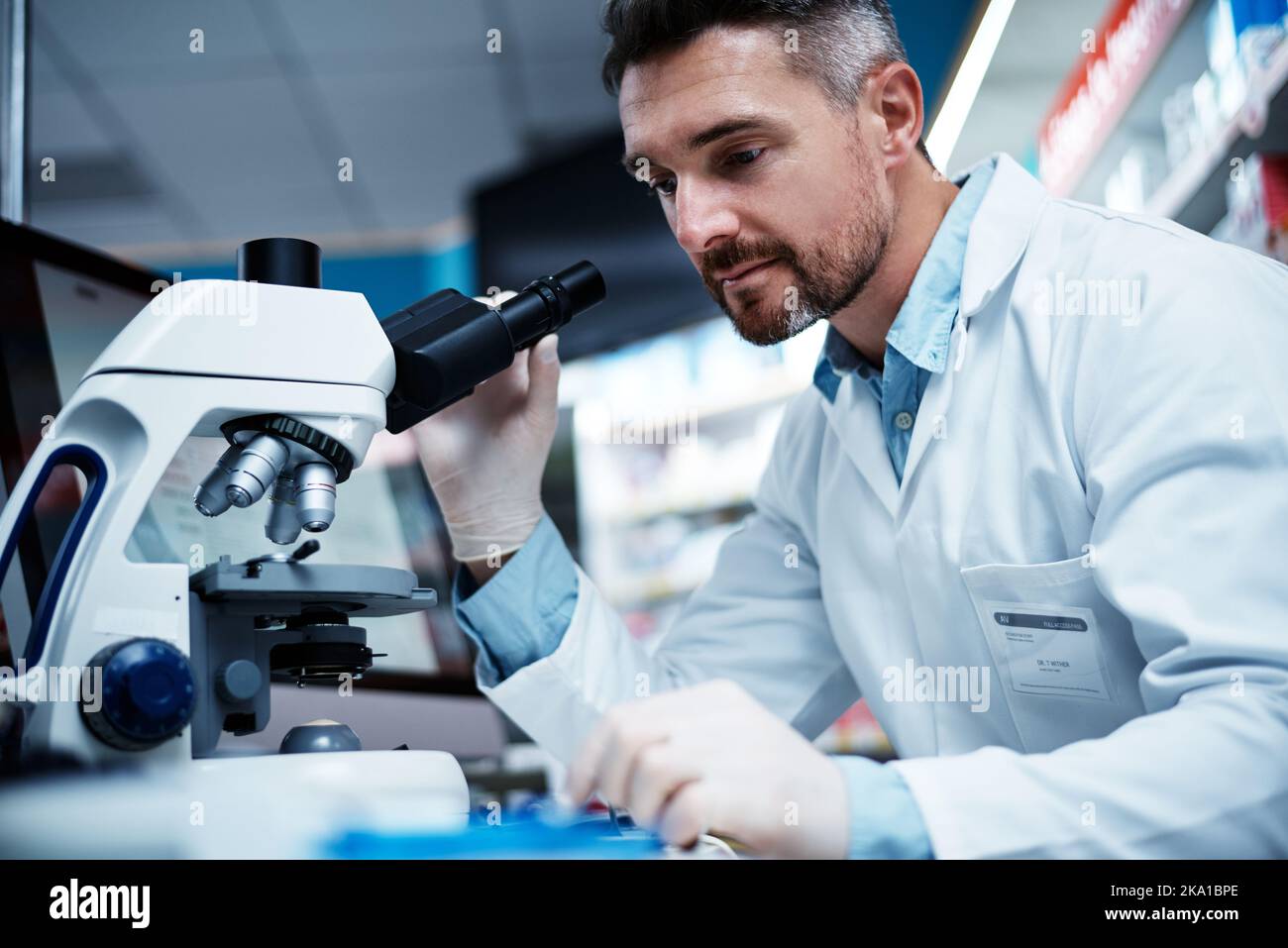 Pharmaceutical research is his specialty. a mature man using a ...