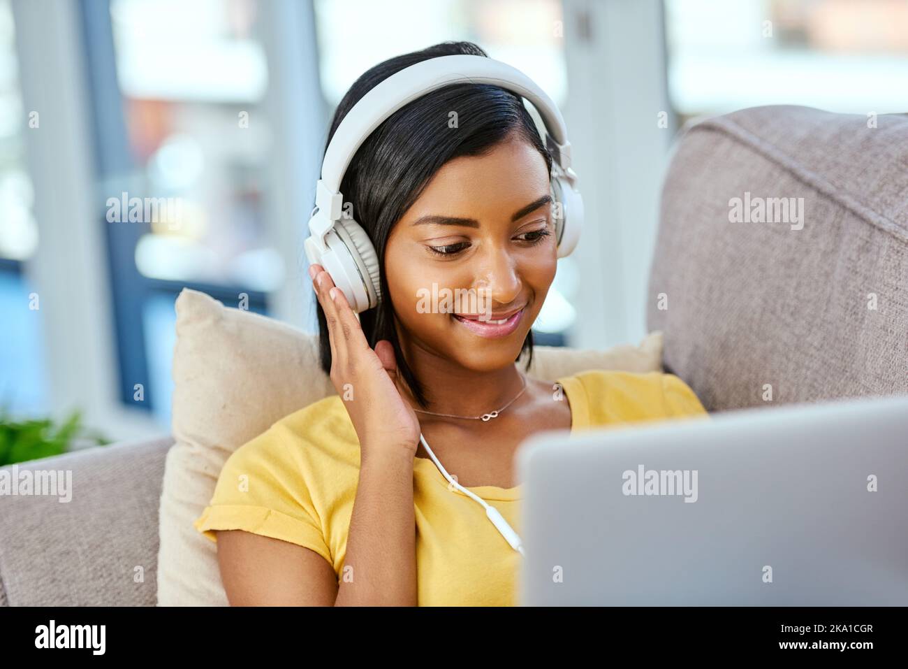 I love checking out new music. a teenage girl listening to music and ...