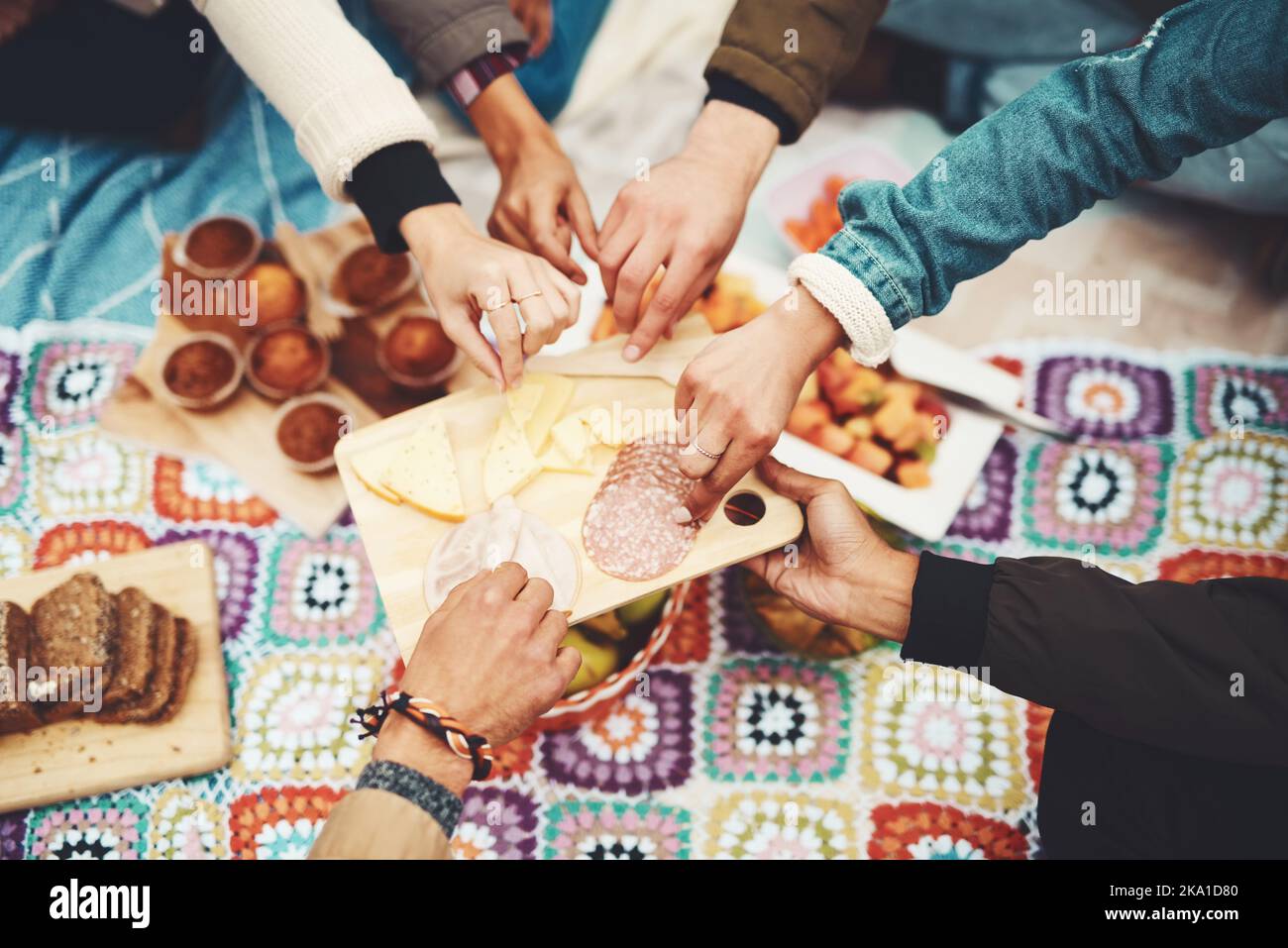 Theres enough for everyone. a group of unrecognizable peoples hands ...
