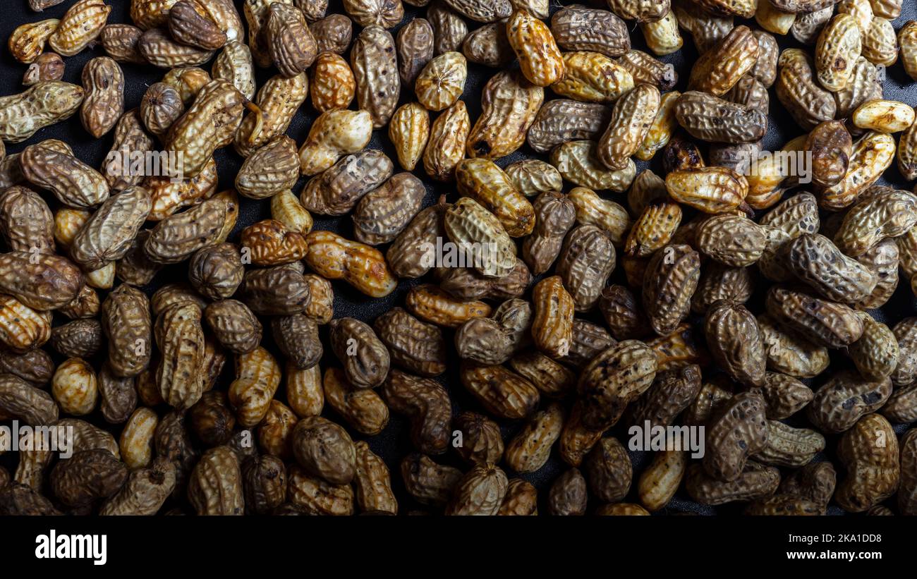 Peanut in a shell texture take from the top. food background of peanuts ...