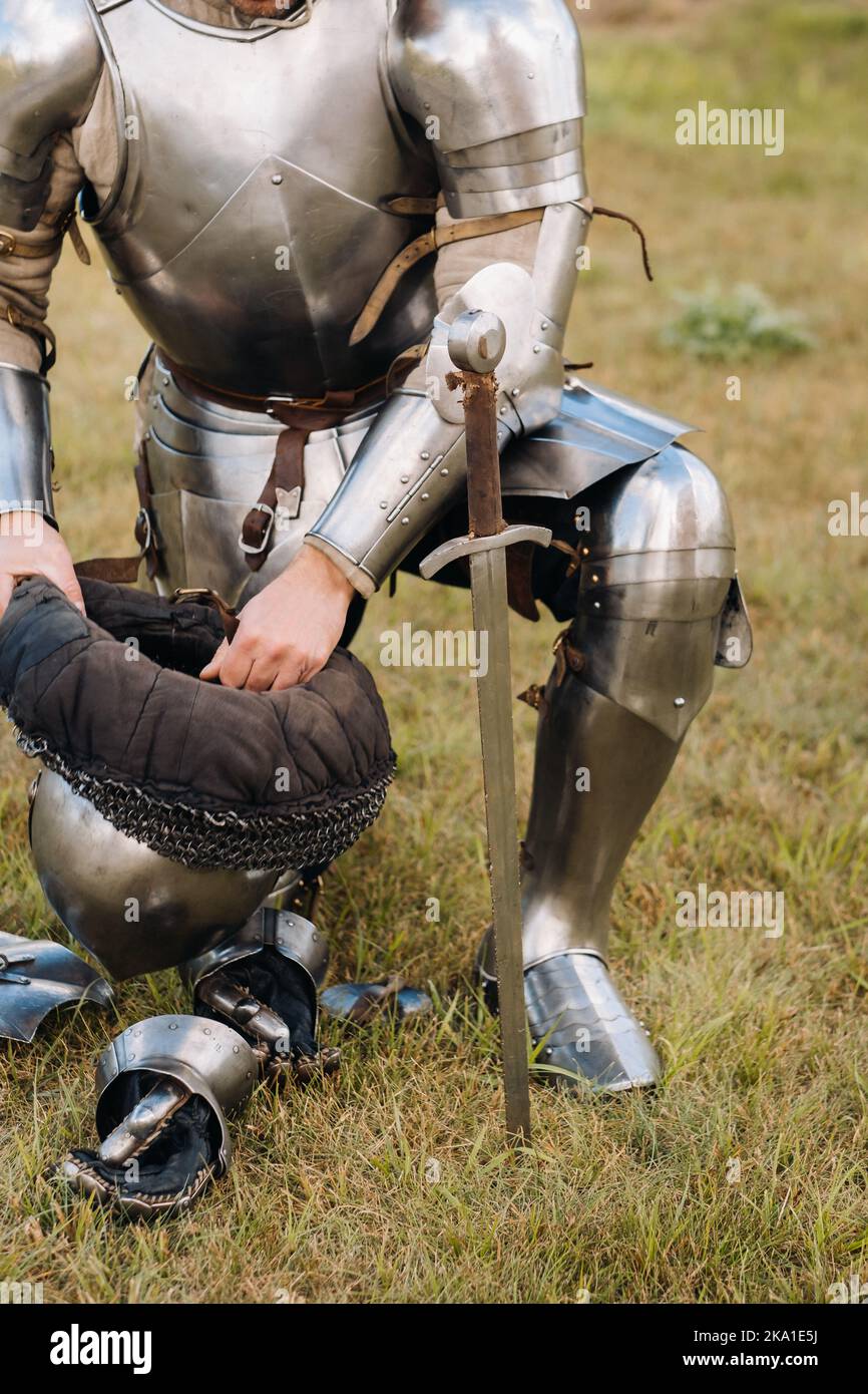 Close-up of a medieval knight in armor preparing for battle Stock Photo - Alamy