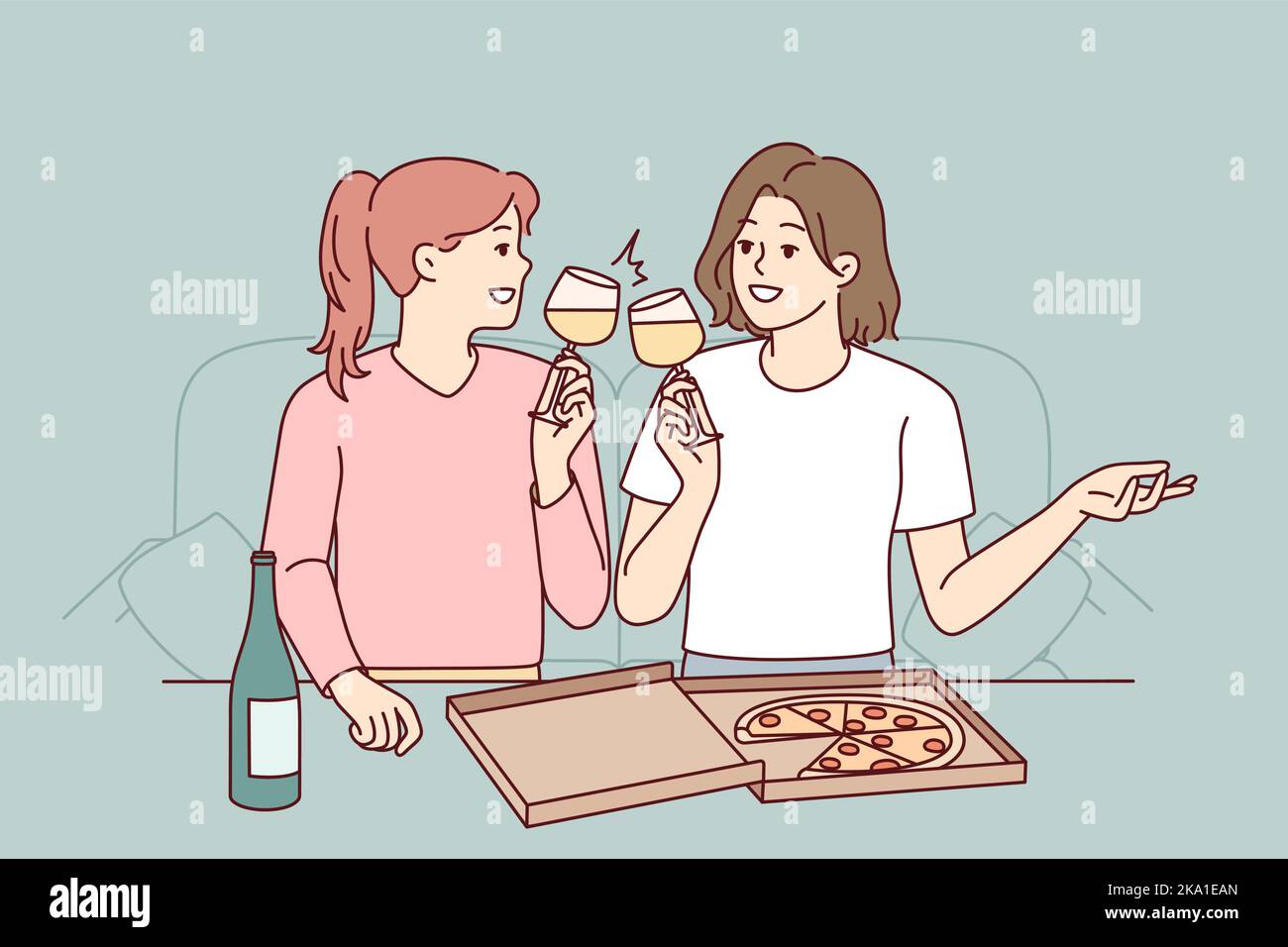 Happy young women sitting on couch at home eating pizza drinking wine ...