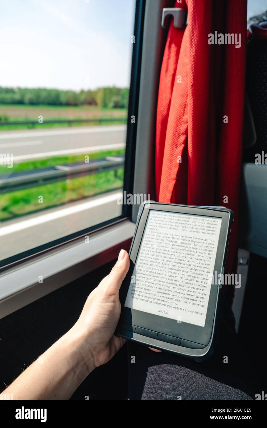 reading book in bus Stock Photo - Alamy