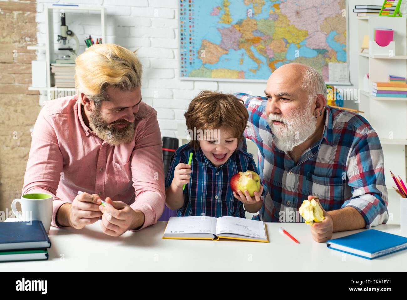 Grandfather father and child son learning at home classroom. Child ...