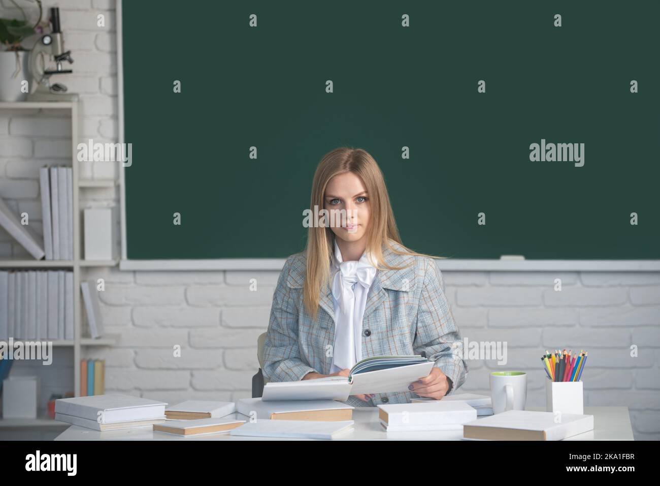 High school student learning english or mathematics in class. Serious ...