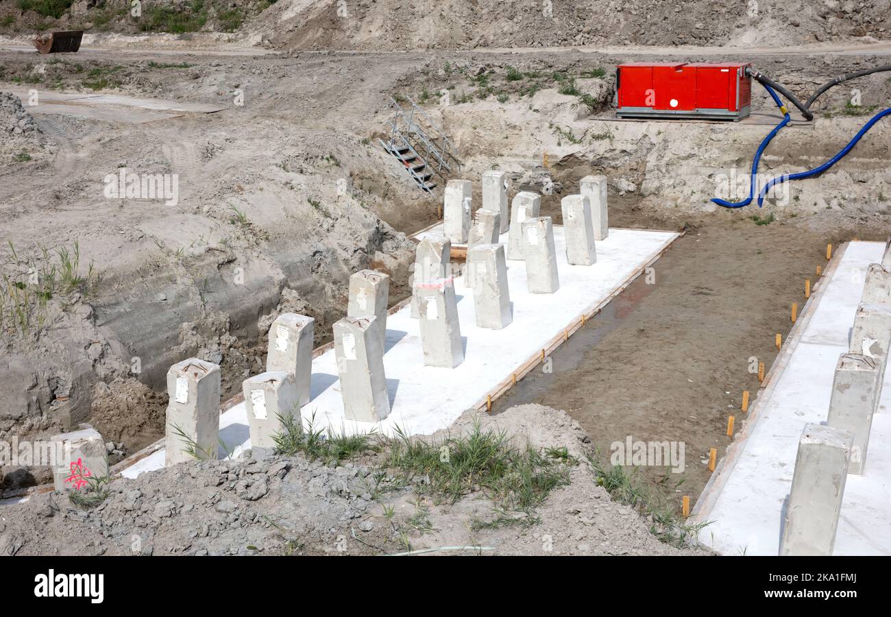 Concrete piles foundation for a new building on construction site ...