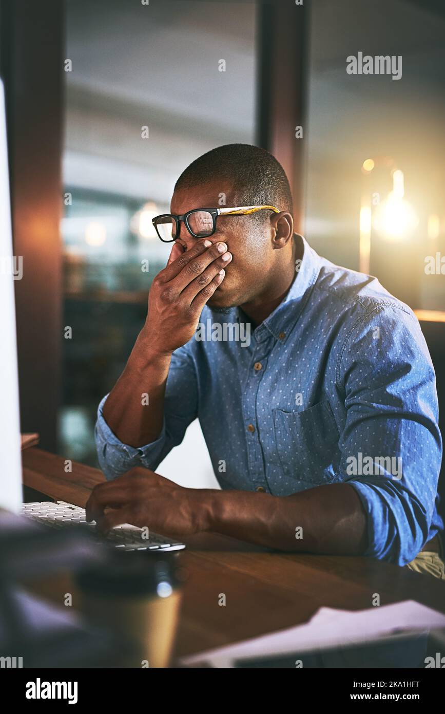 Friday cannot come soon enough. a young businessman experiencing stress ...