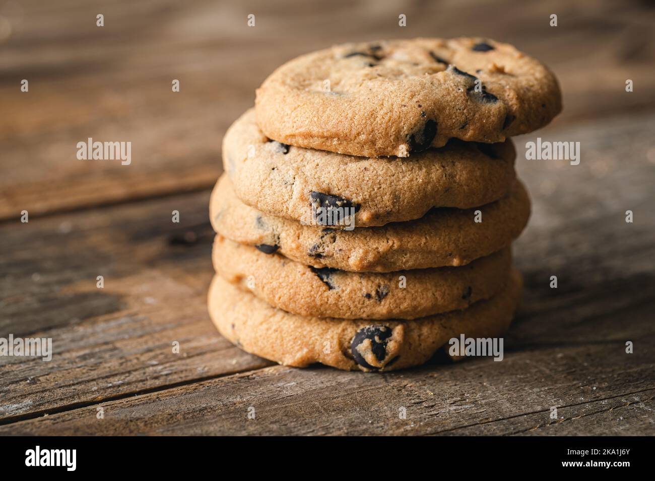 Chocolate chip cookies close up on a wooden background Stock Photo - Alamy