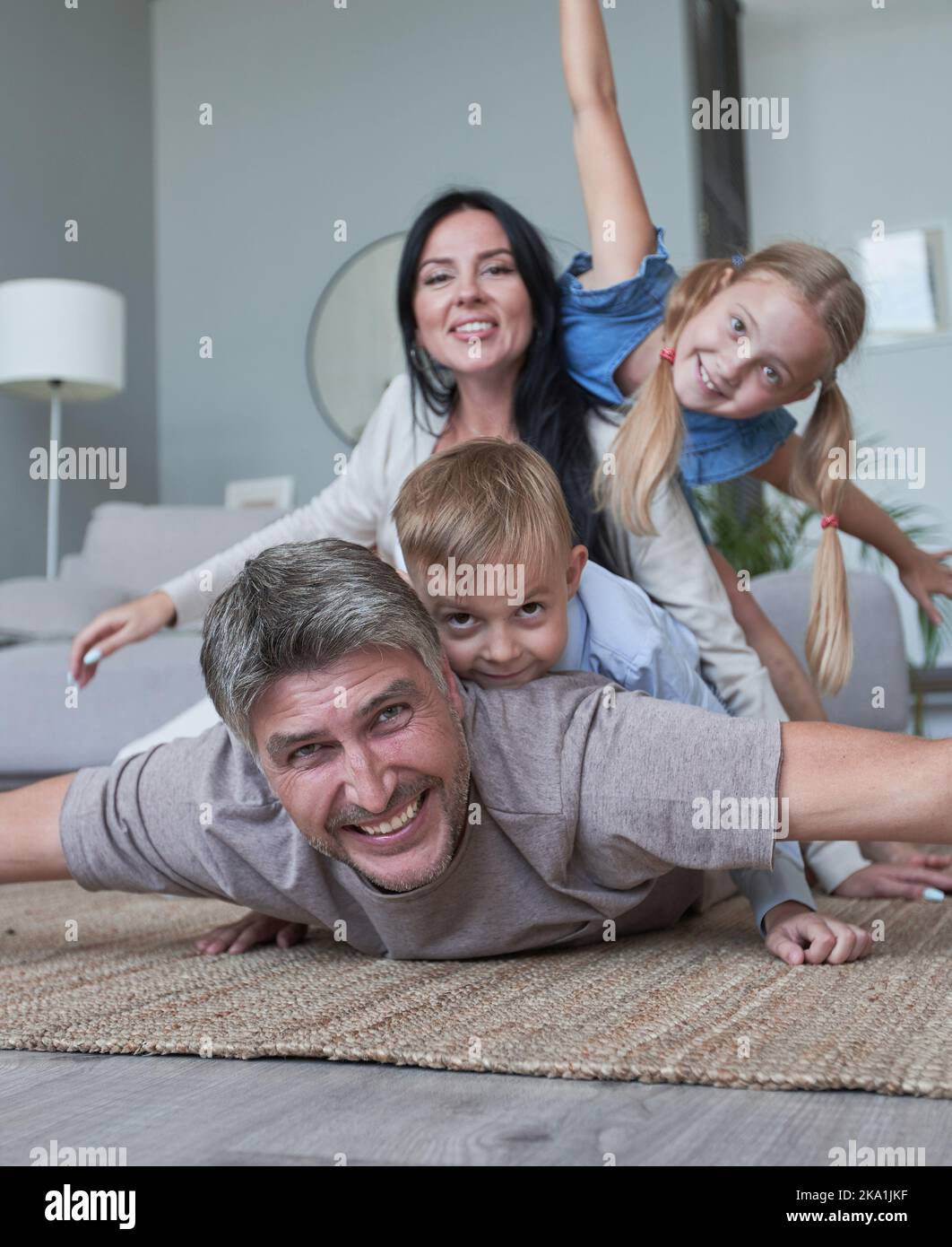Photo of four members adopted family lying floor toothy smiling fluffy ...