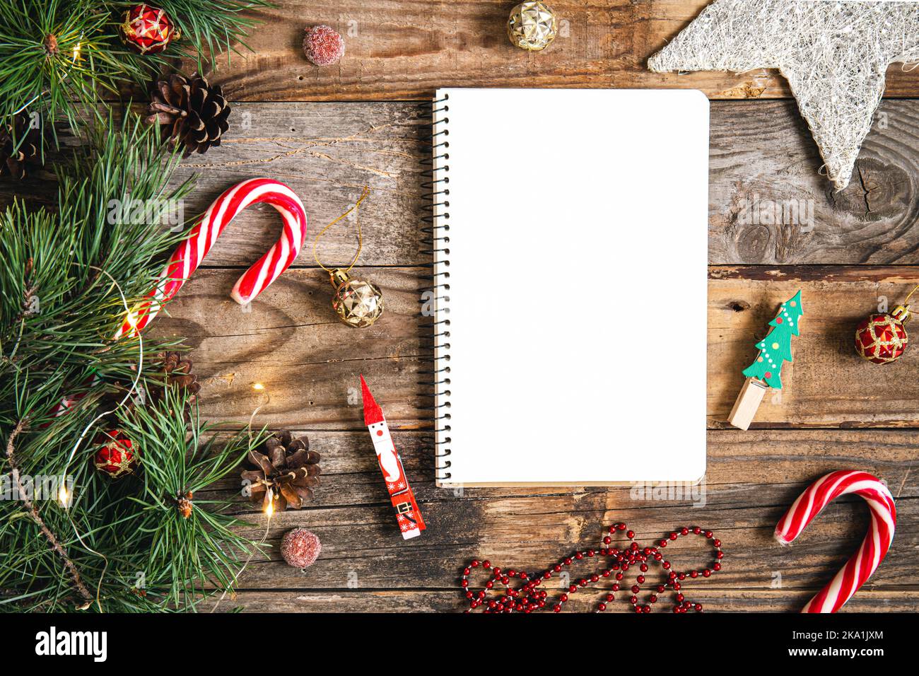 Blank notepad and Christmas decor details on wooden background, flat ...