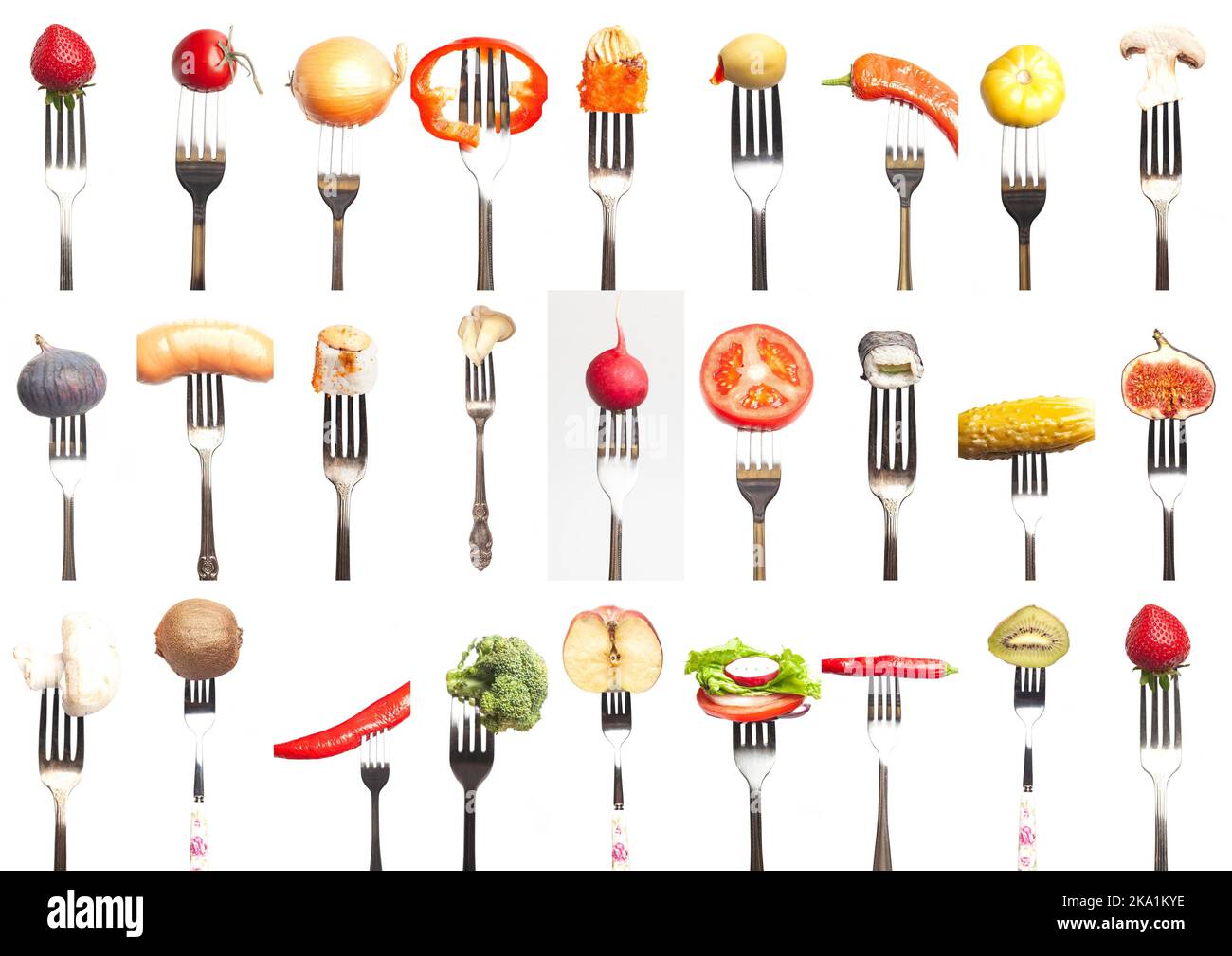 Fruits and vegetables on the forks. Healthy food Stock Photo - Alamy