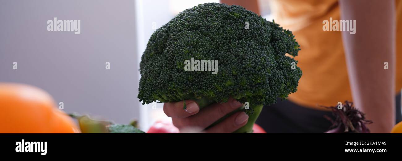 Broccoli and different vegetables in kitchen closeup Stock Photo - Alamy