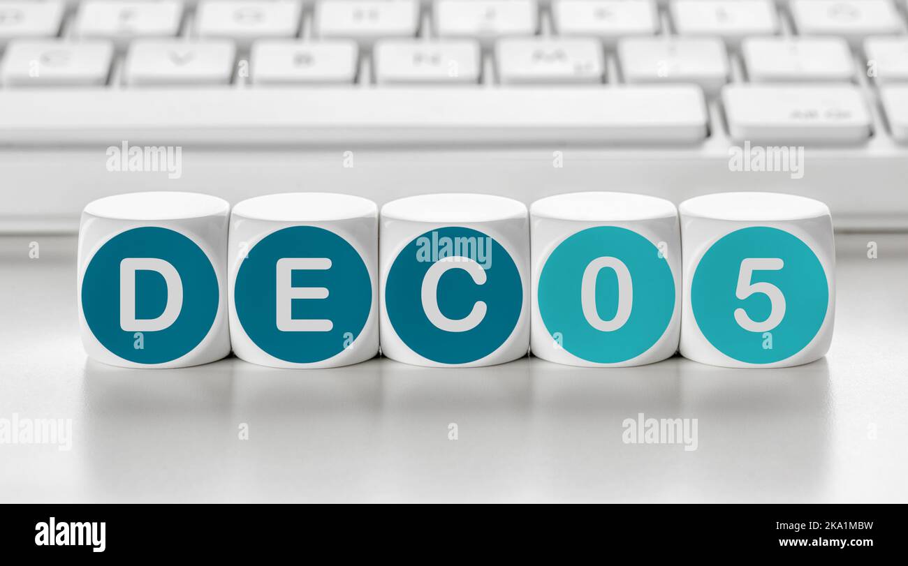 Letter dice in front of a keyboard - December 05 Stock Photo - Alamy