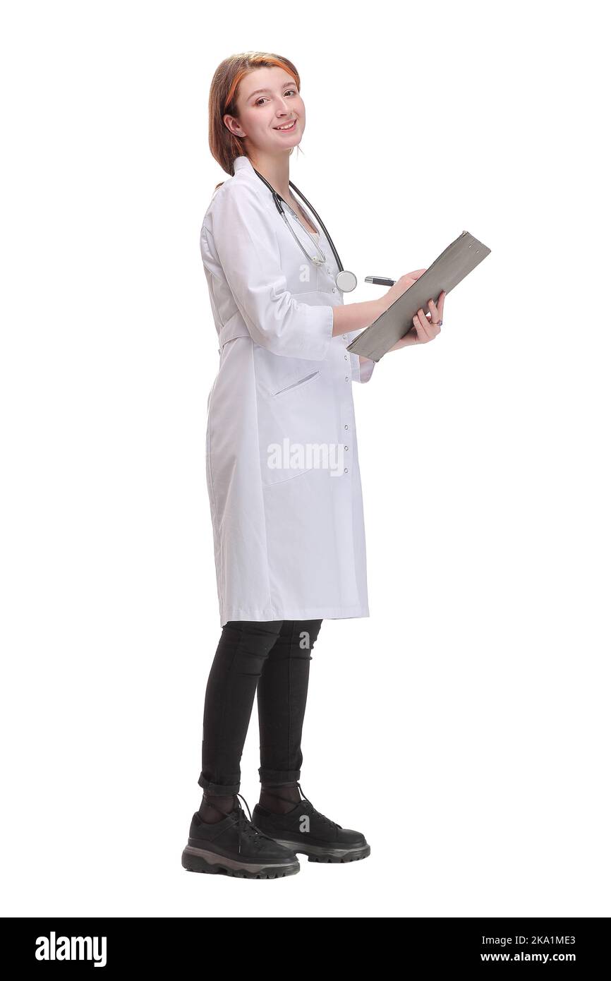 Side view of female doctor filling up medical form on clipboard Stock ...