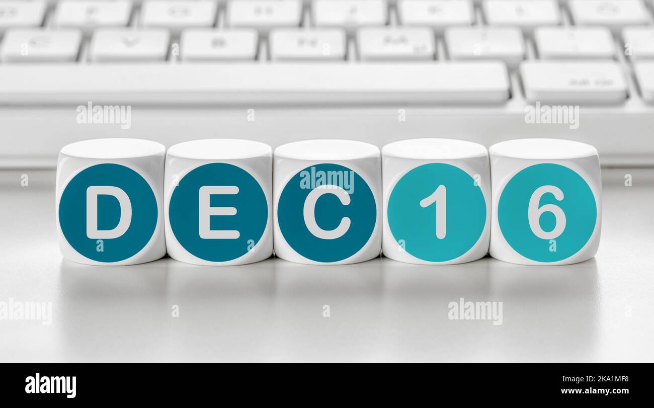 Letter dice in front of a keyboard - December 16 Stock Photo - Alamy