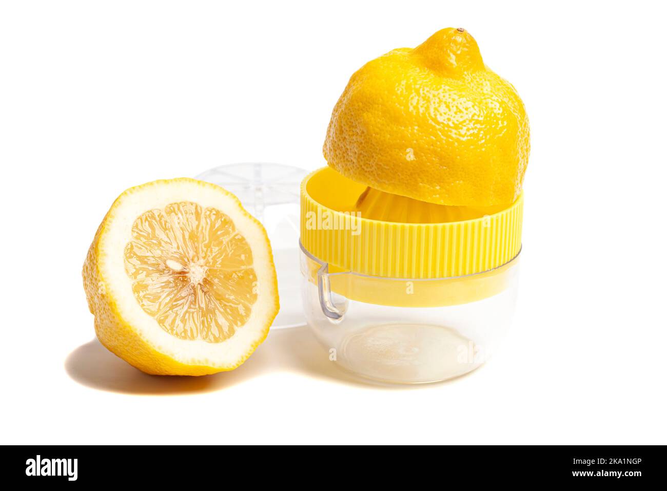 Manual Juicer with lemon isolated on white background Stock Photo - Alamy