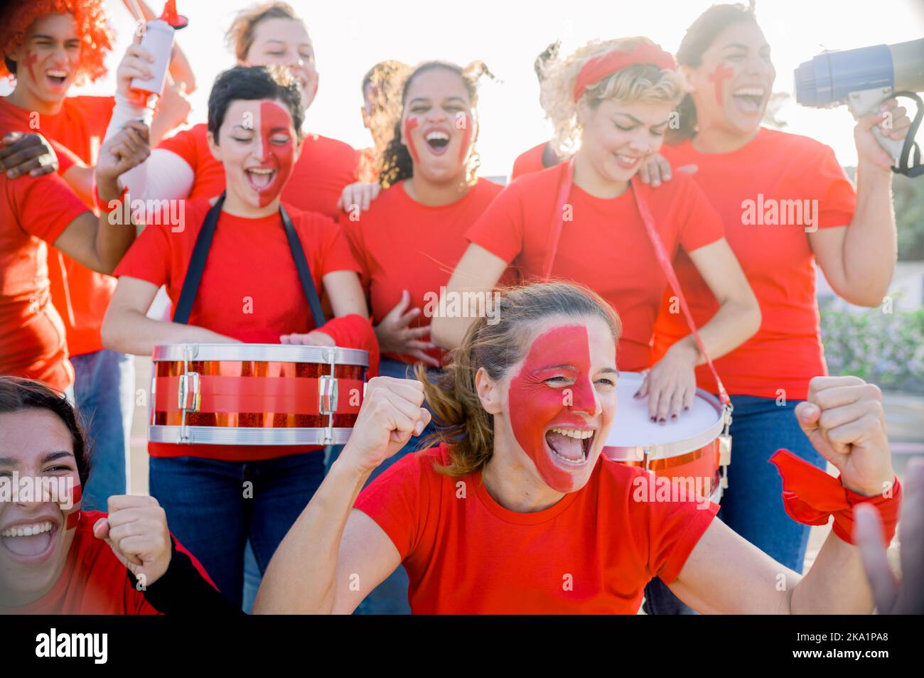 Joyful diverse football fans yelling happily during World Cup match ...