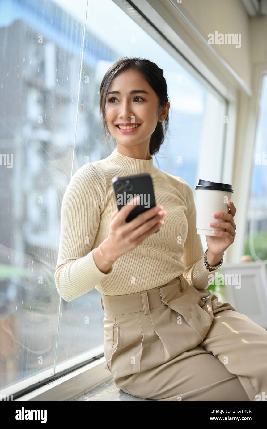 Portrait, Attractive and happy young Asian female manager or ...