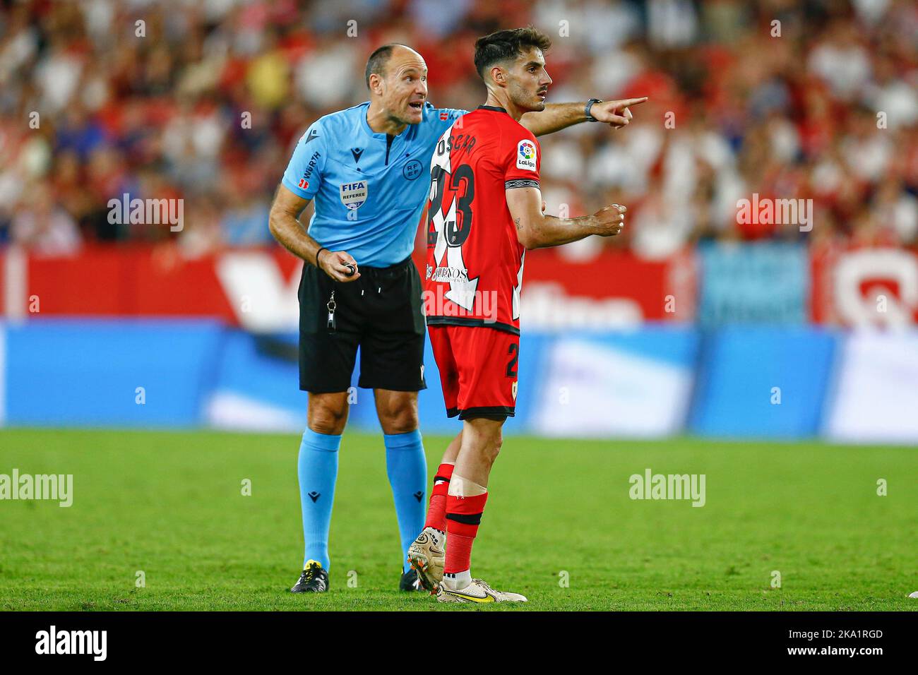 The referee Antonio Mateu Lahoz and Oscar Valentin of Rayo Vallecano ...