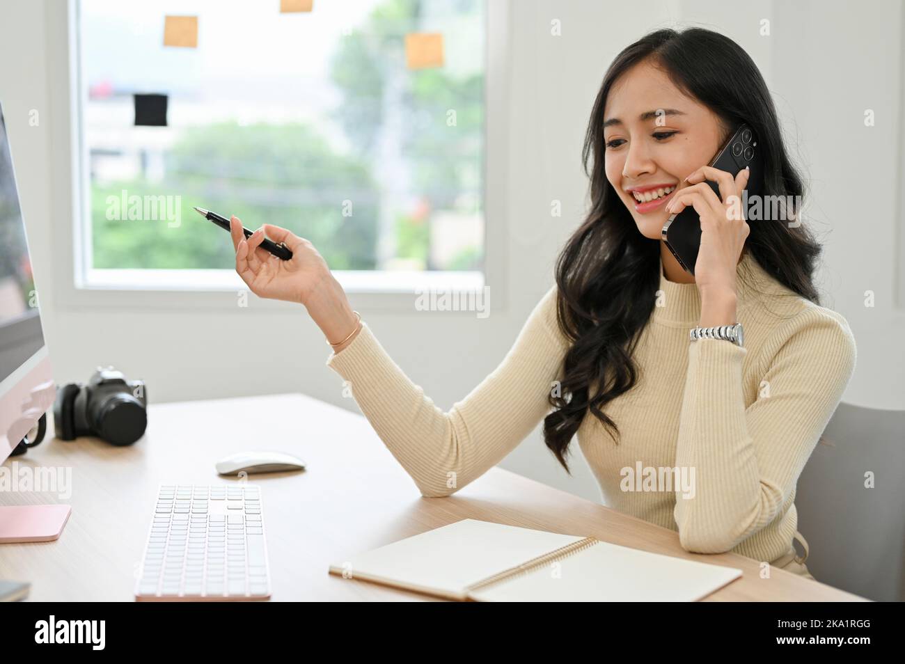 Attractive beautiful millennial Asian businesswoman or female account ...