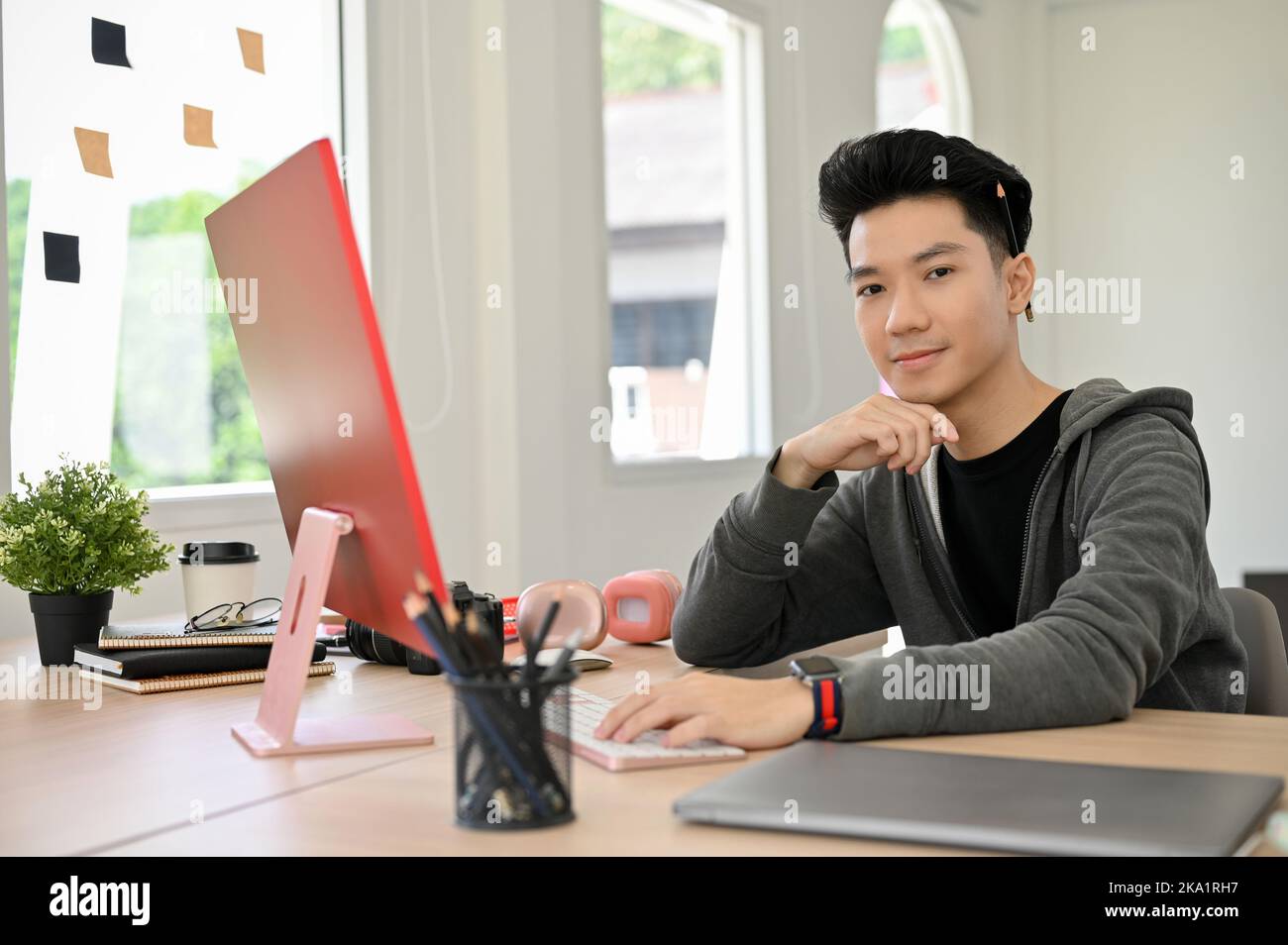 Portrait Handsome And Smart Young Asian Male Programmer To Web Developer In Casual Clothes