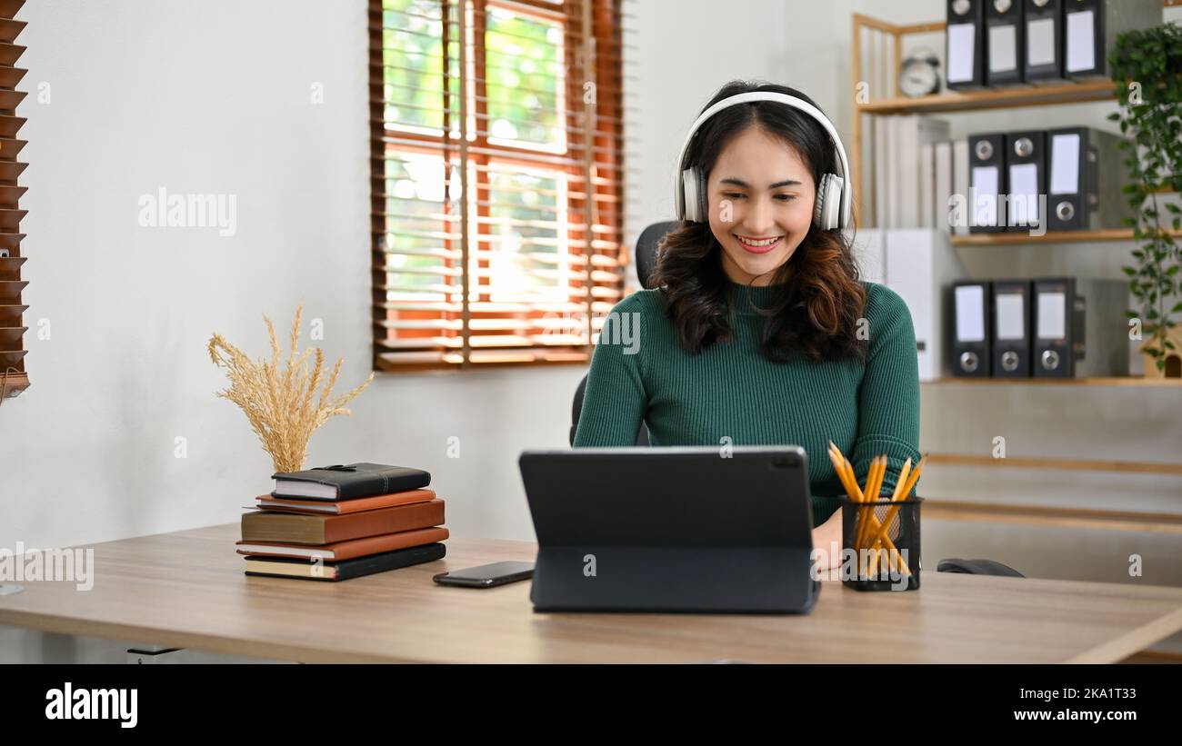 Charming millennial Asian female manager or businesswoman wearing ...