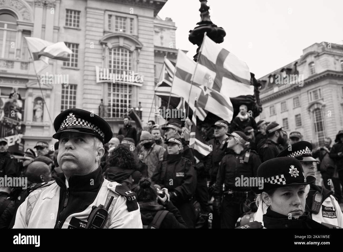 London, UK. March 21, 2015. A bored police officer pulls a face whilst ...