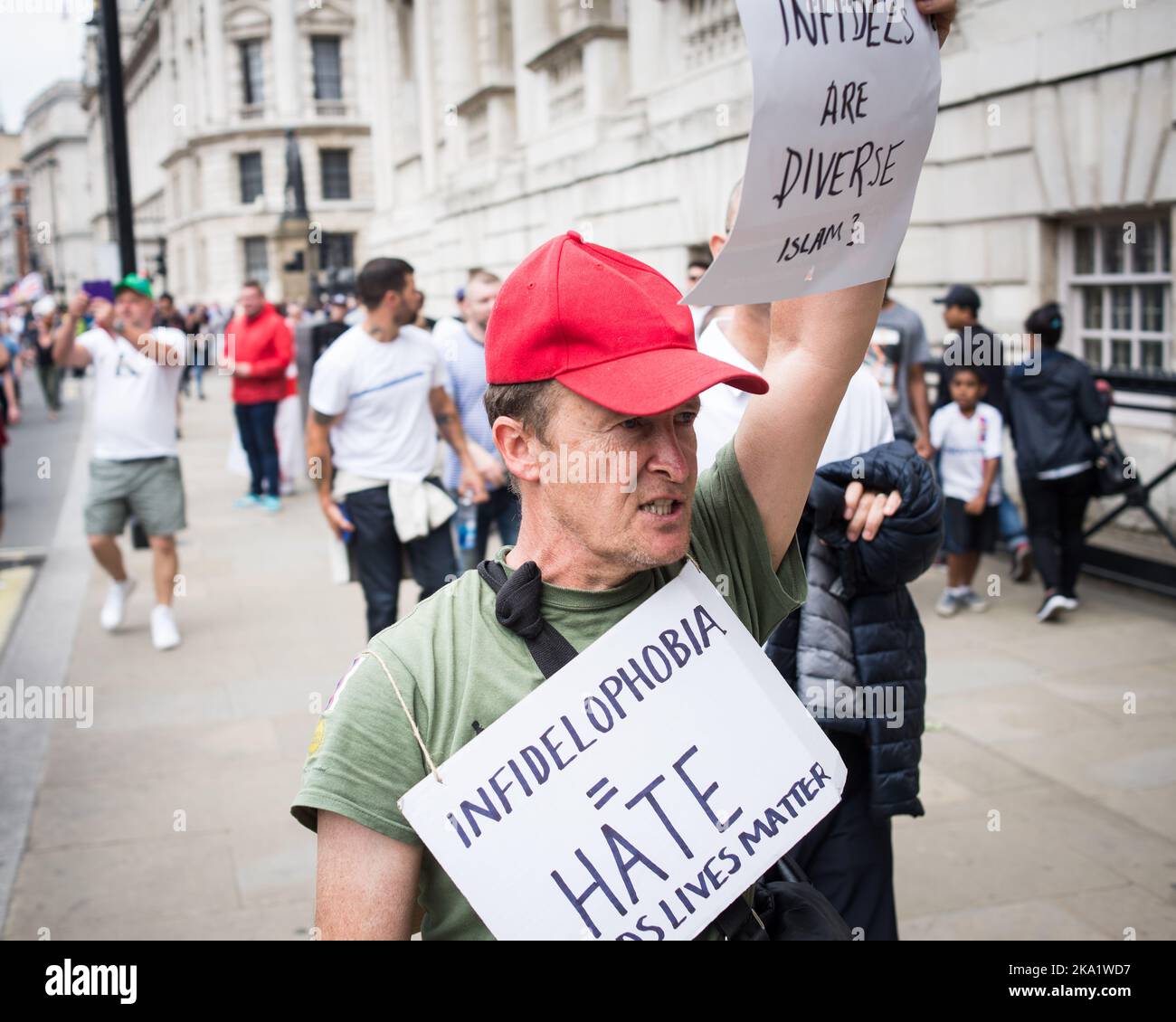 London, UK. June 9 2018. A man in a red hat holds signs which says ...
