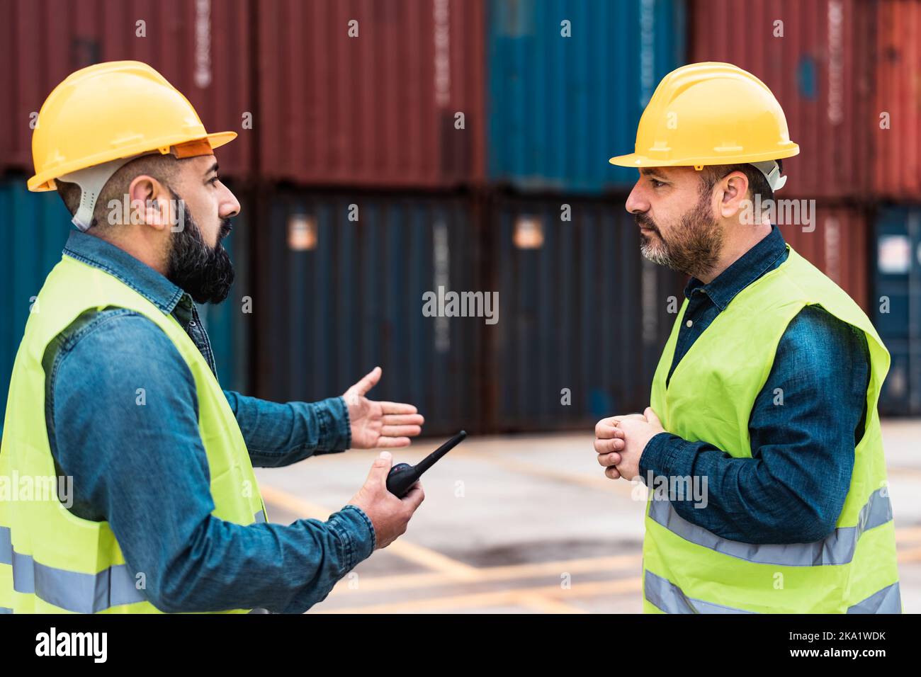 Industrial engineers working in logistic terminal of container cargo ...