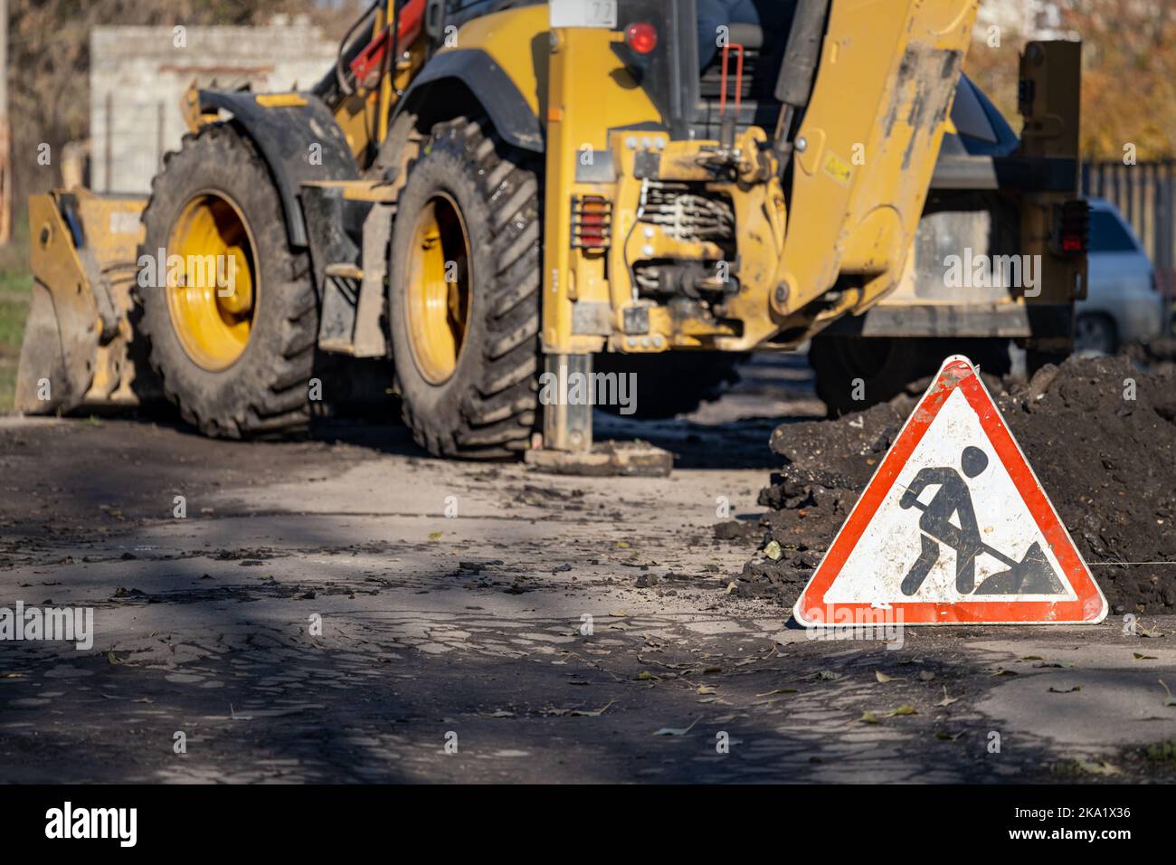 road sign warning about work on the road. Men at work Stock Photo - Alamy