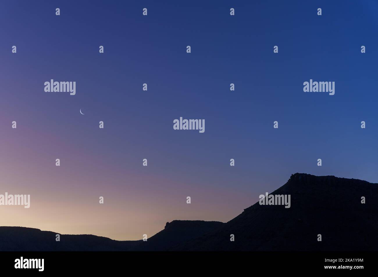 Sunset sky, crescent moon and scenic view of Karoo National Park ...