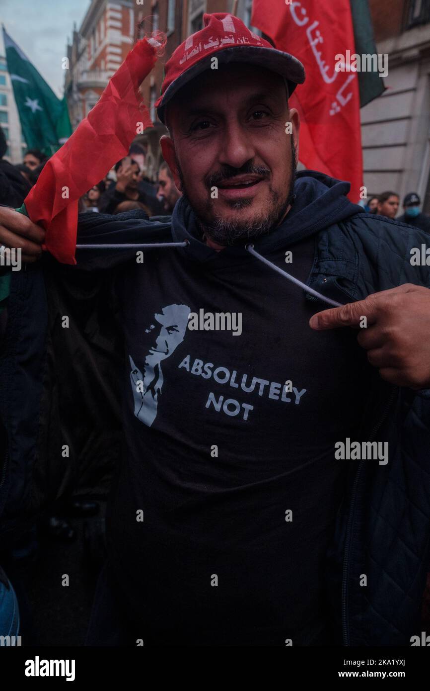 Supporters of Pakistan Tehreek-e-Insaf arrive at Avenfield House where ...