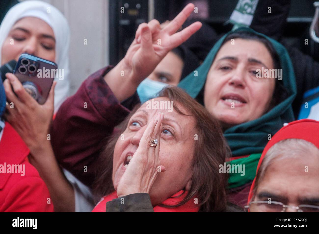 Supporters of Pakistan Tehreek-e-Insaf arrive at Avenfield House where ...
