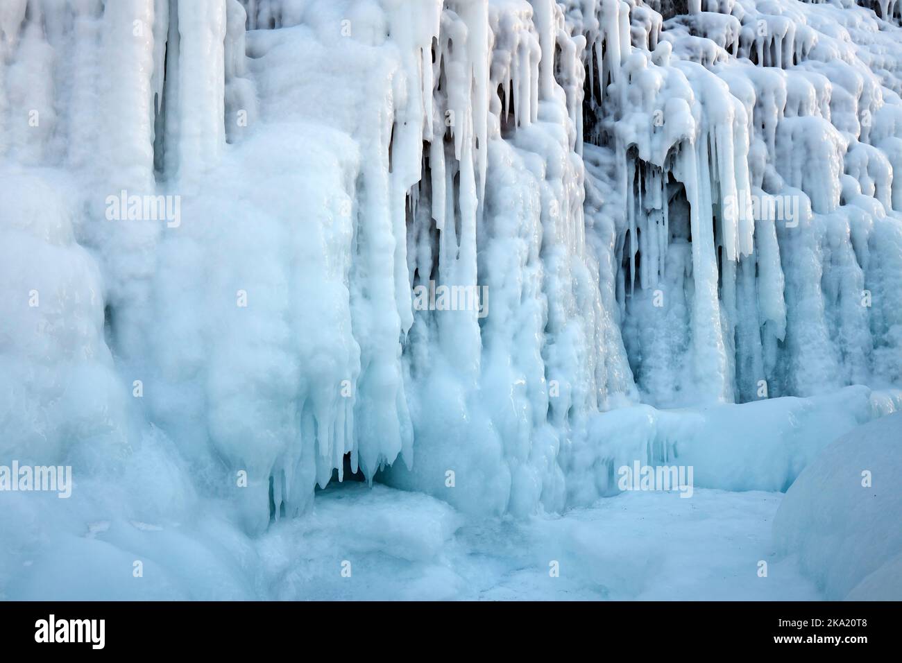 Waterfall like Icicles of frozen spray Stock Photo - Alamy