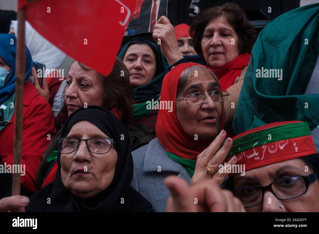 Supporters of Pakistan Tehreek-e-Insaf arrive at Avenfield House where ...