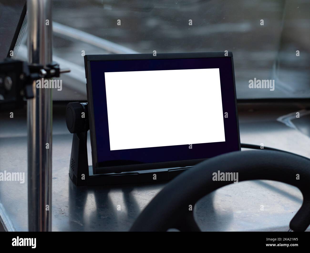 Blank screen of a navigation device in a cockpit of a boat. External ...