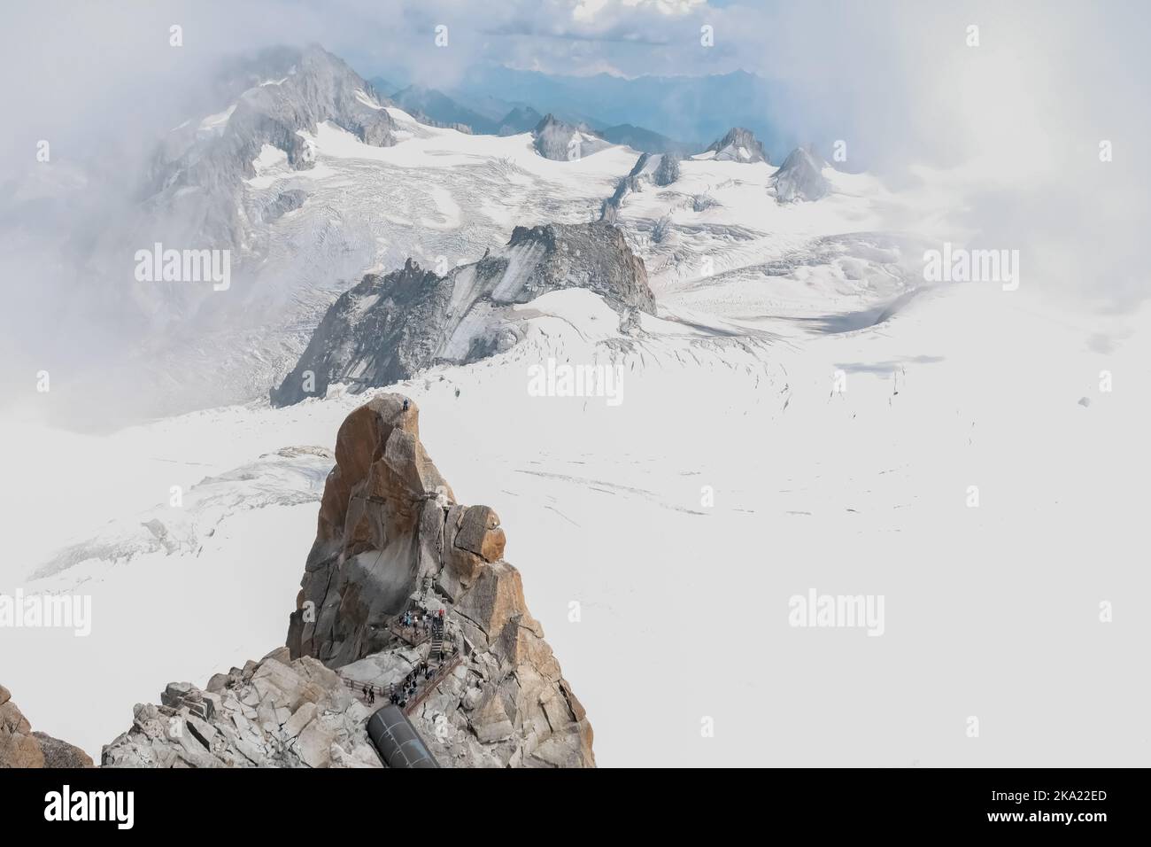 Climbers traverse mountain ridges and rocks near Montblanc Stock Photo ...
