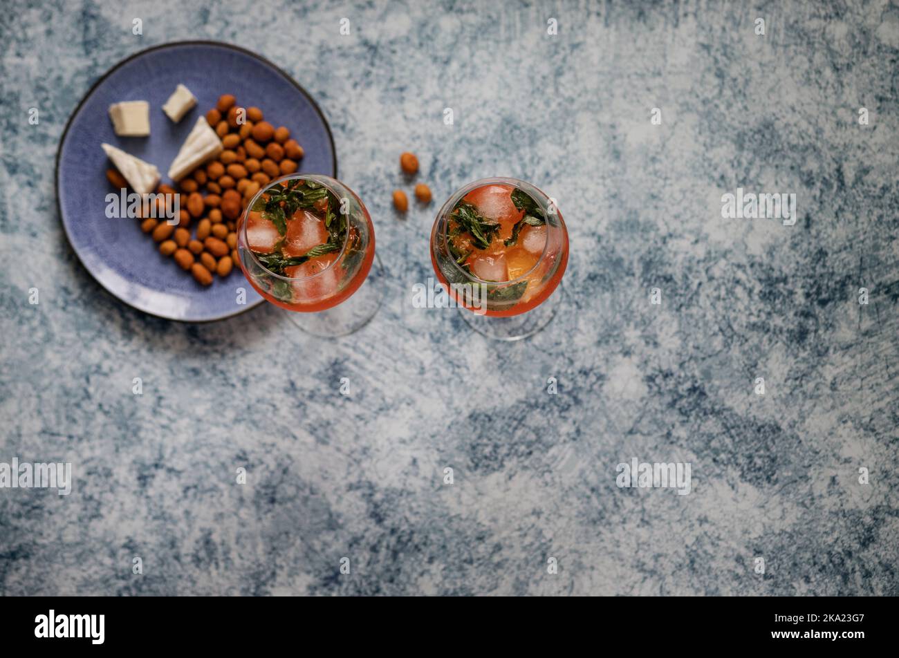 two cocktails with whiskey. lemonade, ice tea with fresh mint. Top view ...