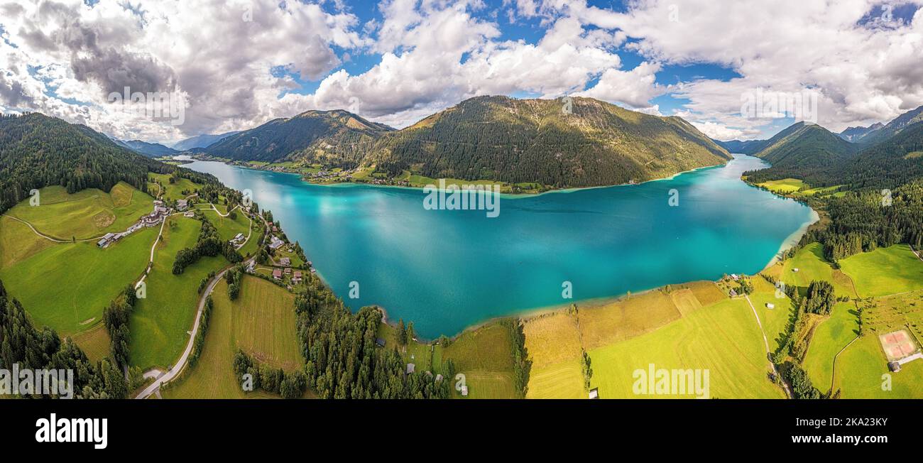 Drone panorama over turquoise lake Weissensee in Austrian province of ...
