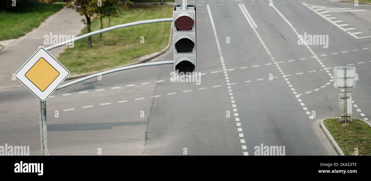 Traffic light showing red signal. Traffic light hanging over the road ...