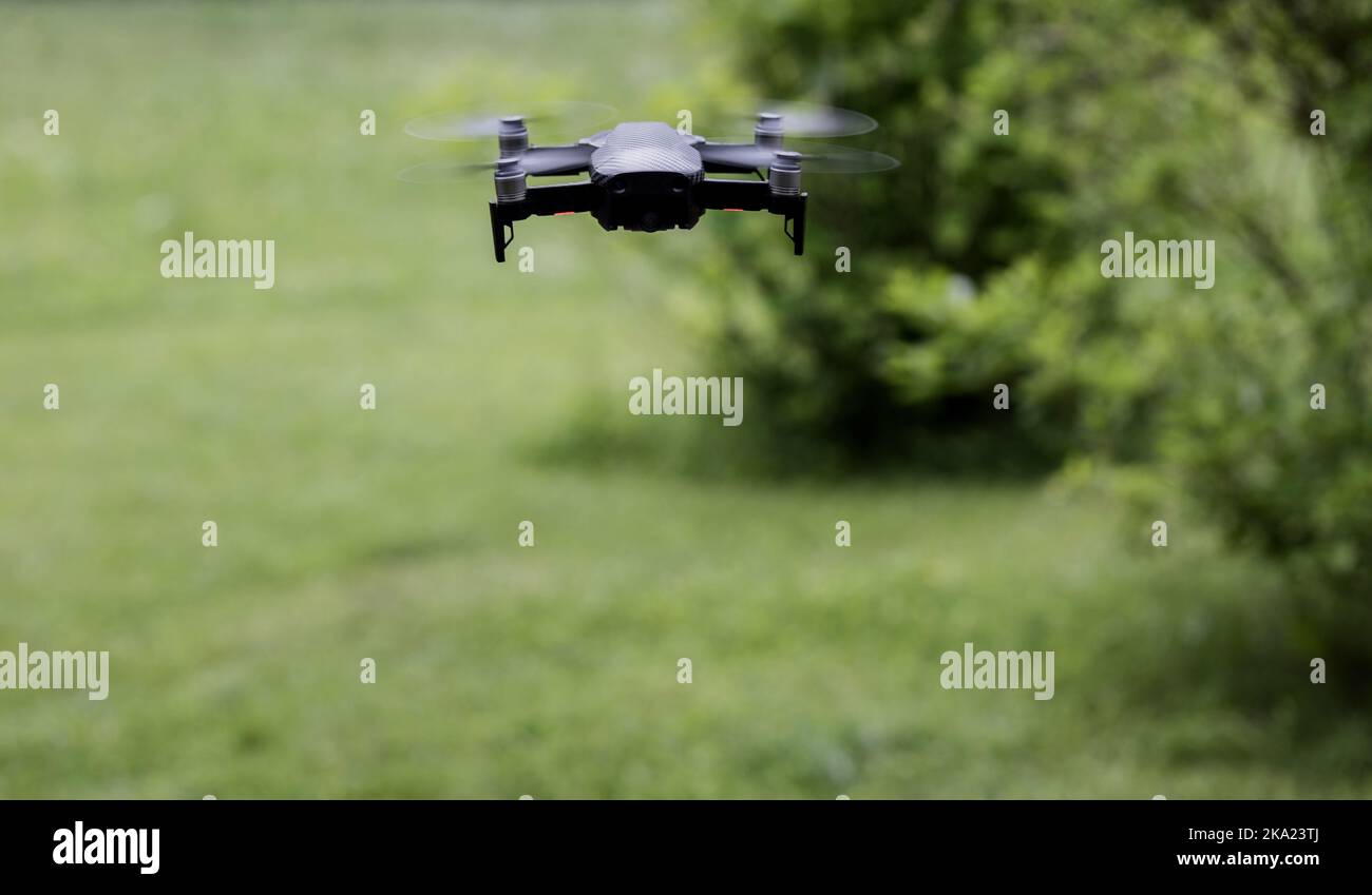 black drone spy. quadcopter. innovation Stock Photo - Alamy